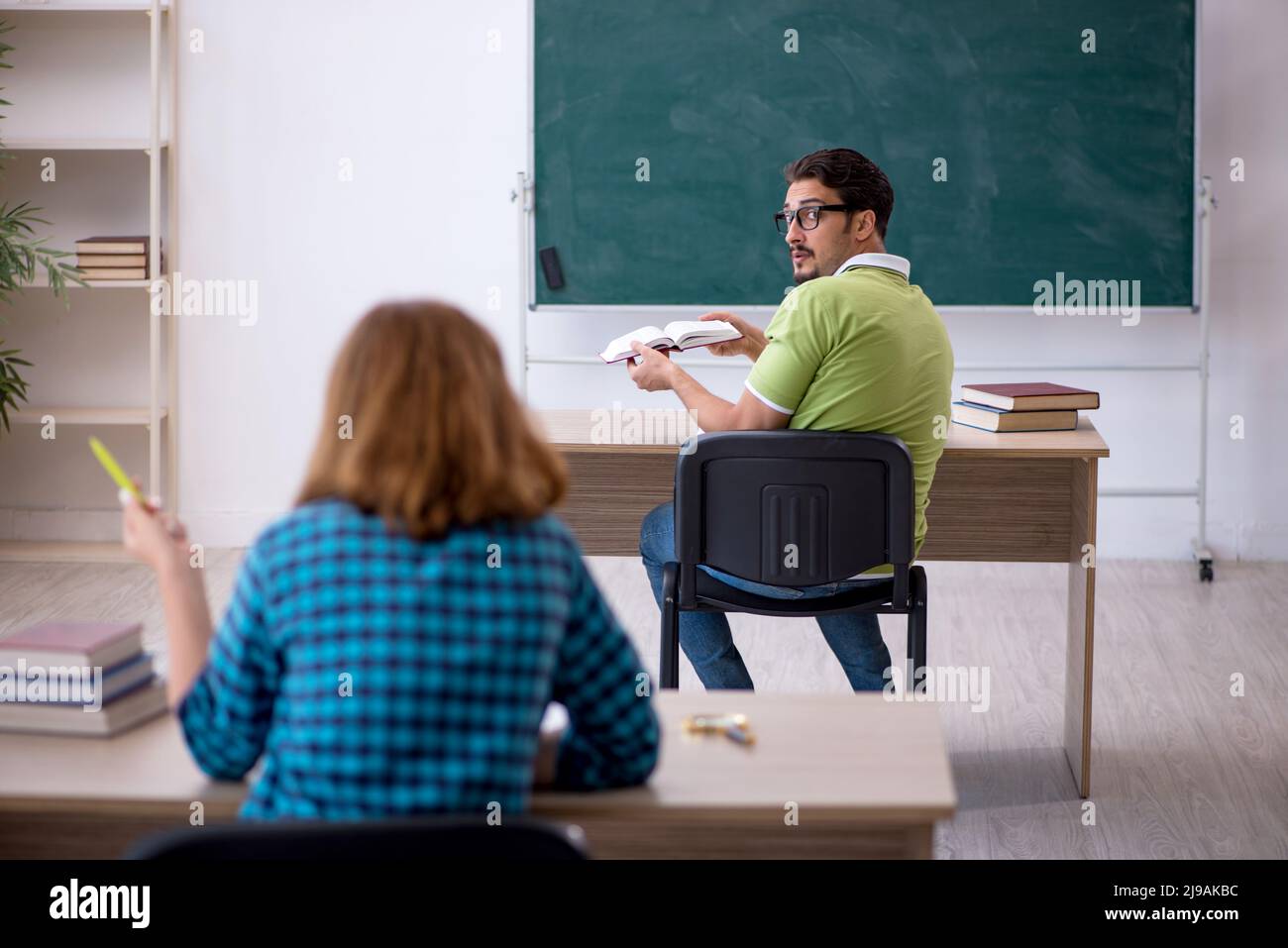 Two students sitting in the class Stock Photo - Alamy