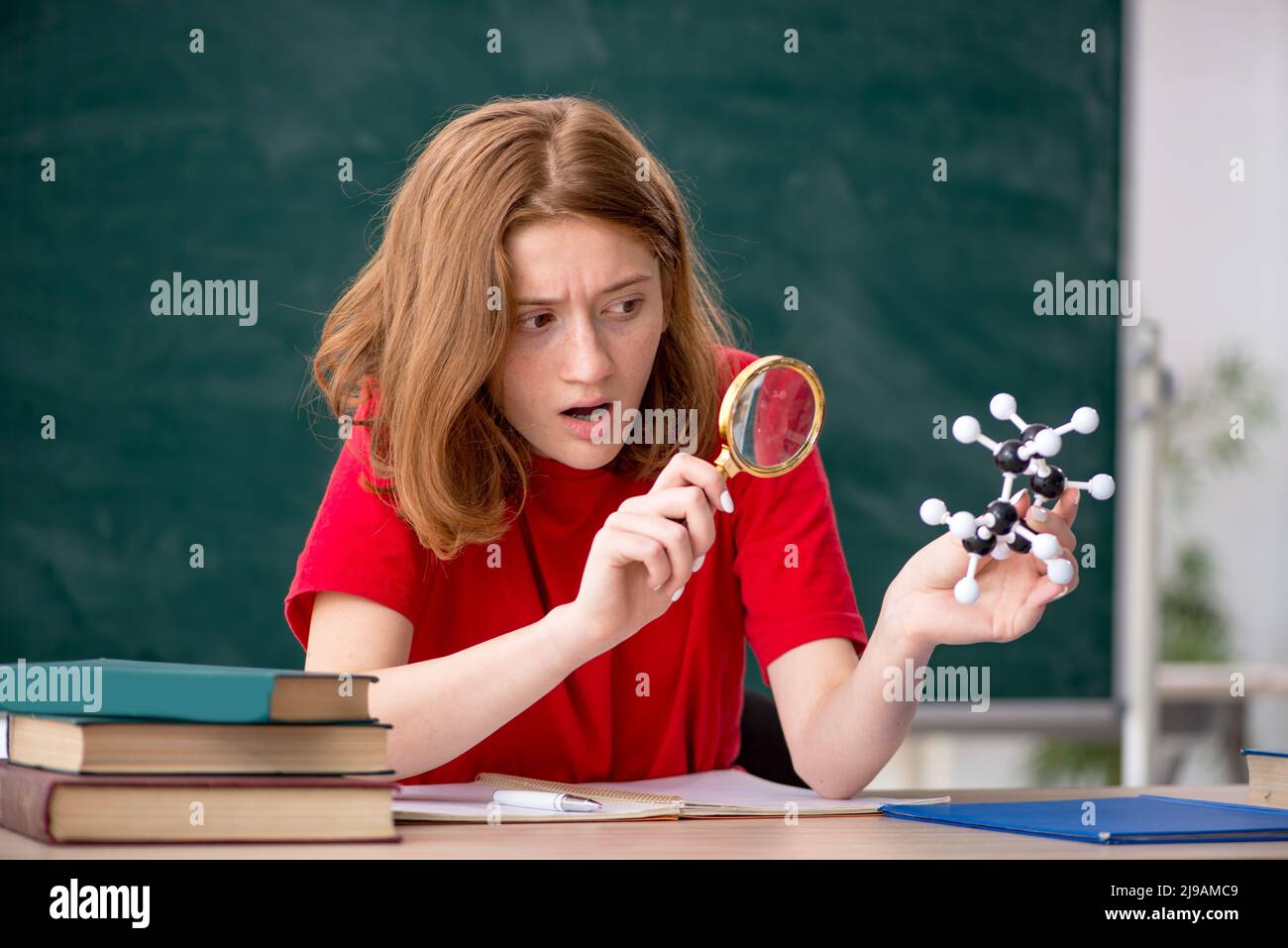 Female student chemist preparing for exams in the classroom Stock Photo ...