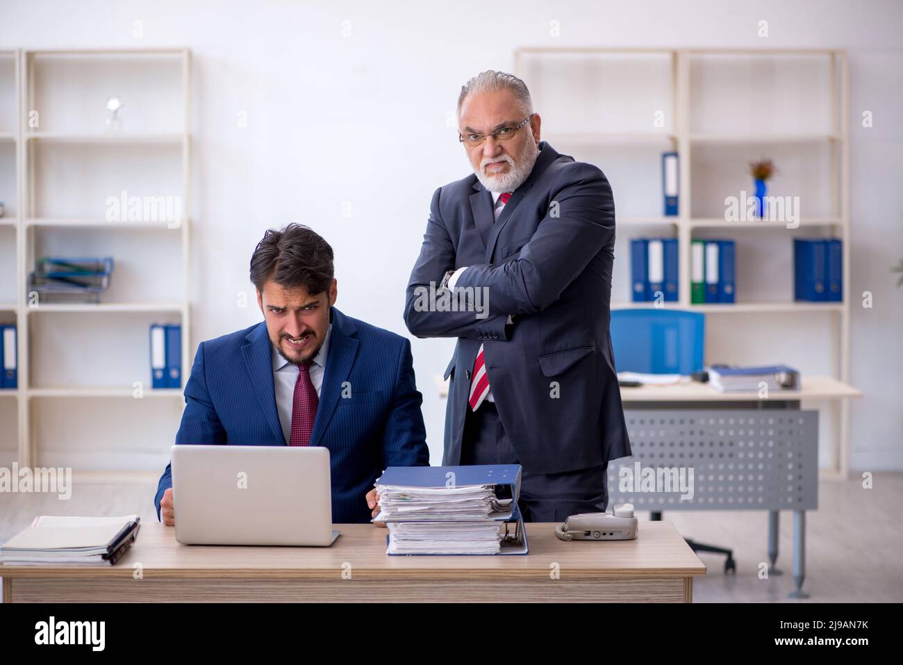 Two colleagues working in the office Stock Photo - Alamy