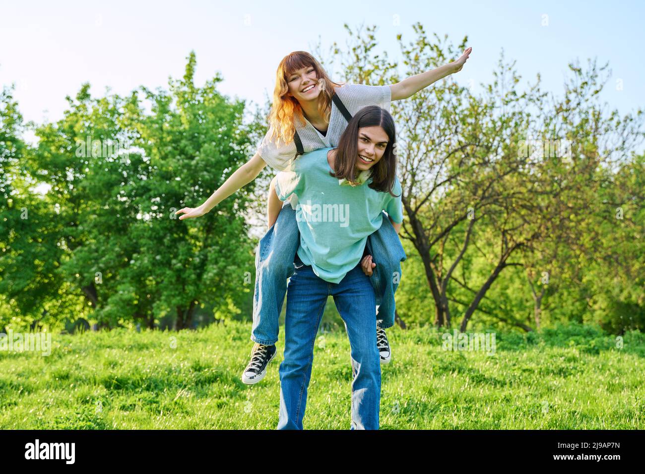 Couple of happy having fun teenagers together outdoor Stock Photo - Alamy