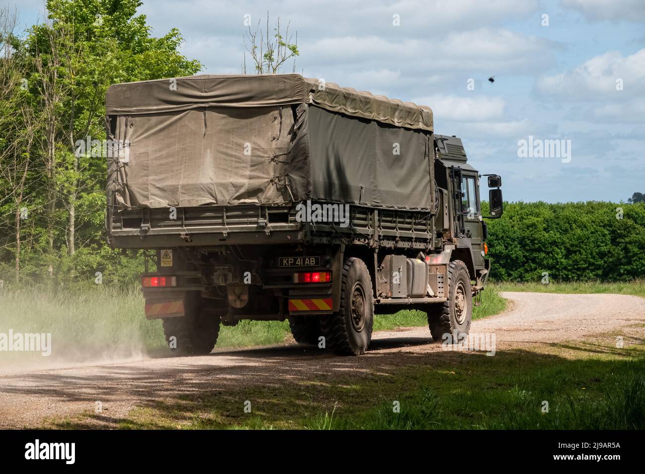 British Army MAN SV 4x4 logistics truck driving away from camera on a ...