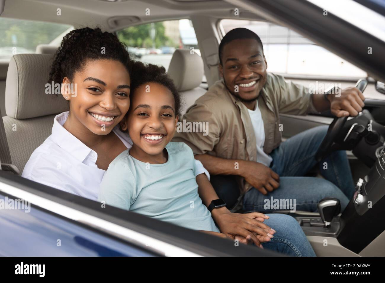 African American Family Of Three Driving Car Sitting In Automobile ...