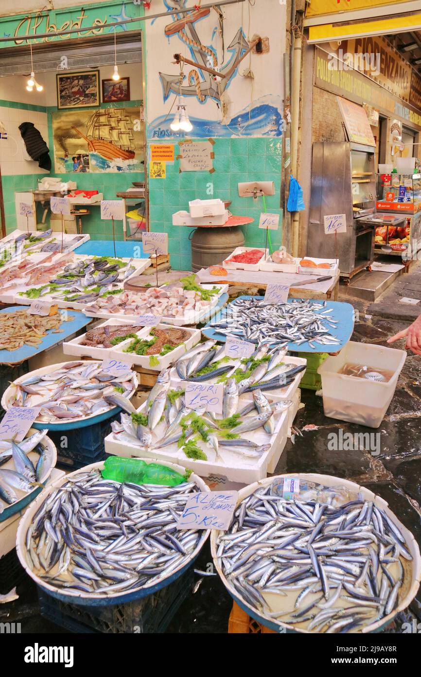 A stall selling fish in a popular market in Naples, Italy Stock Photo ...