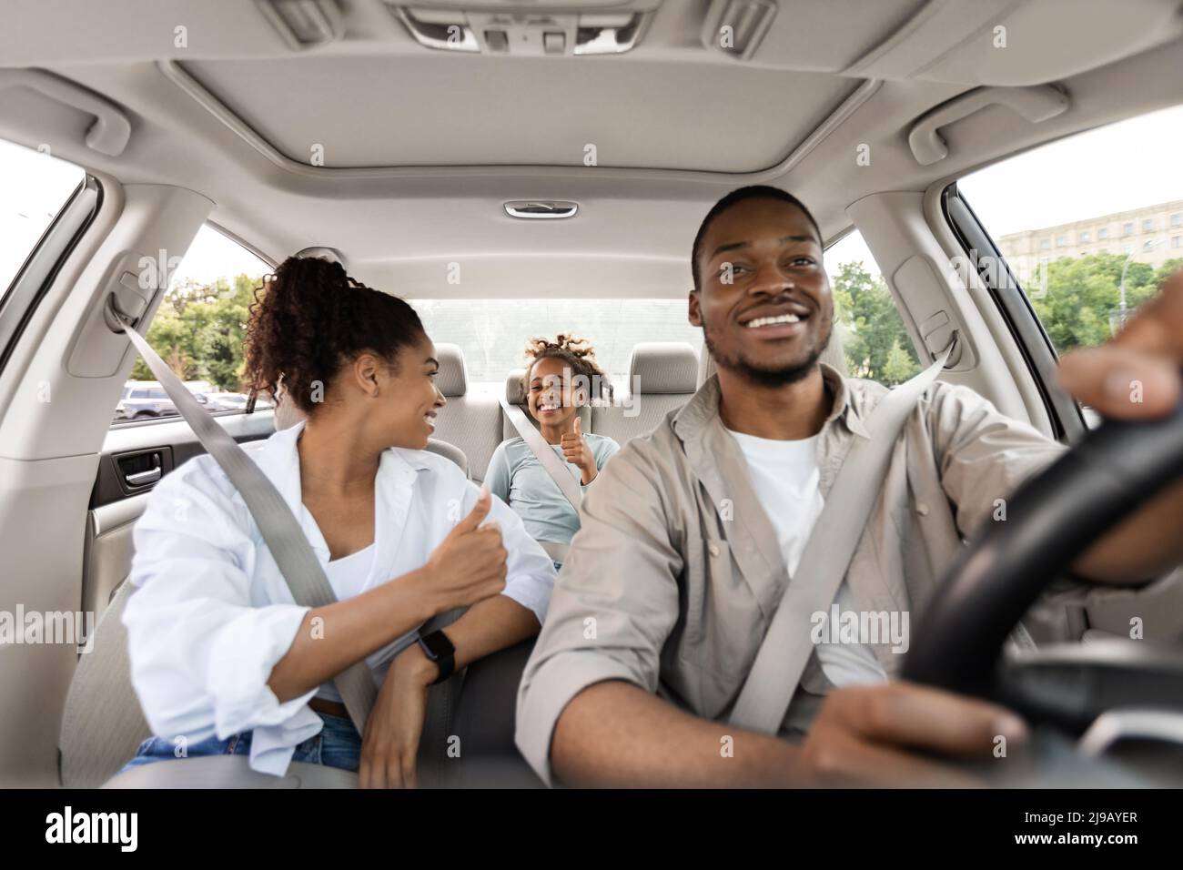 Happy Black Family Driving Own Car Gesturing Thumbs Up Stock Photo - Alamy