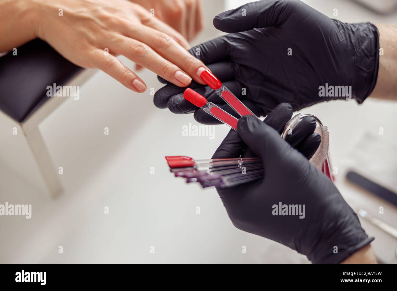 Professional nail master doing perfect manicure in salon Stock Photo ...