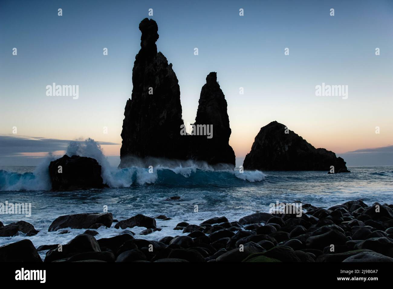 Waves crashing on Ilhéus da Ribeira da Janela sea stacks, Madeira ...