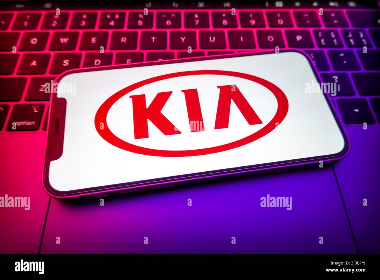 In this photo illustration, a Kia Motors logo is displayed on a smartphone Stock Photo - Alamy