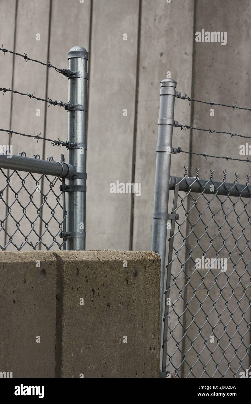 Barbed wire fence protecting something important Stock Photo - Alamy