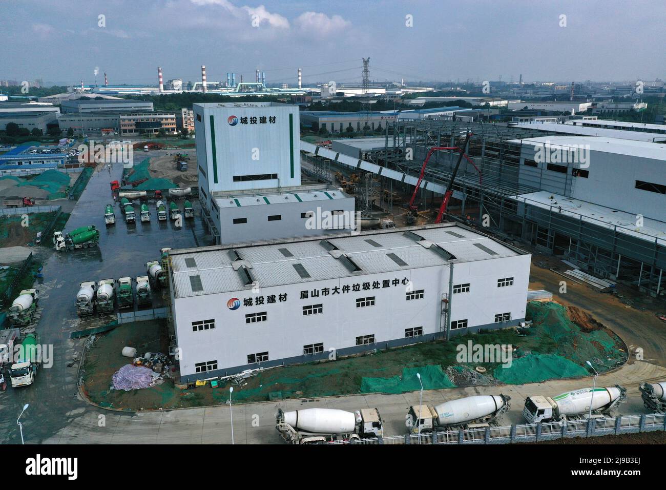 MEISHAN, CHINA - MAY 22, 2022 - Workers transport large pieces of waste ...