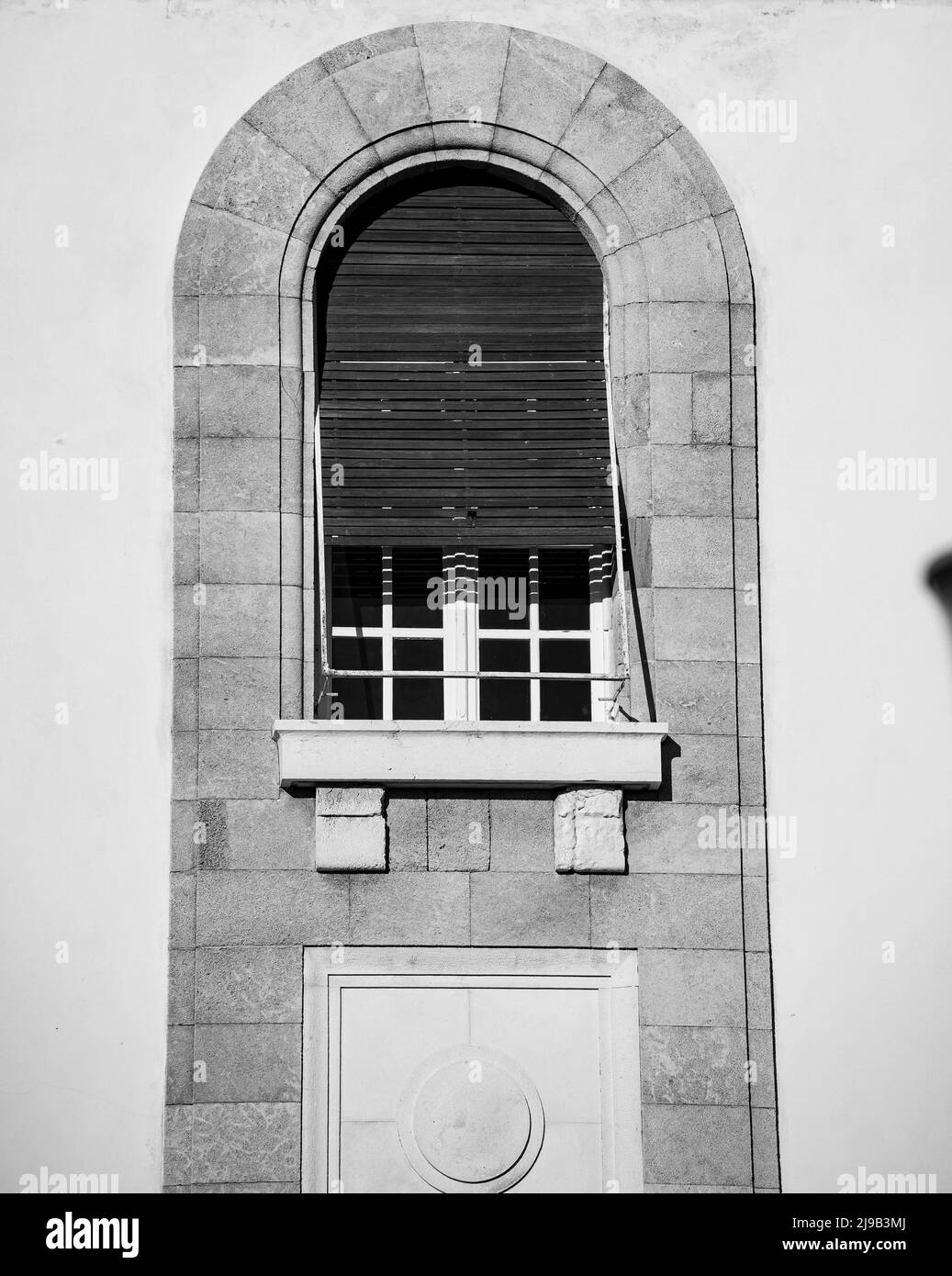 Antique old arch window with open wooden window shutters,in black and ...