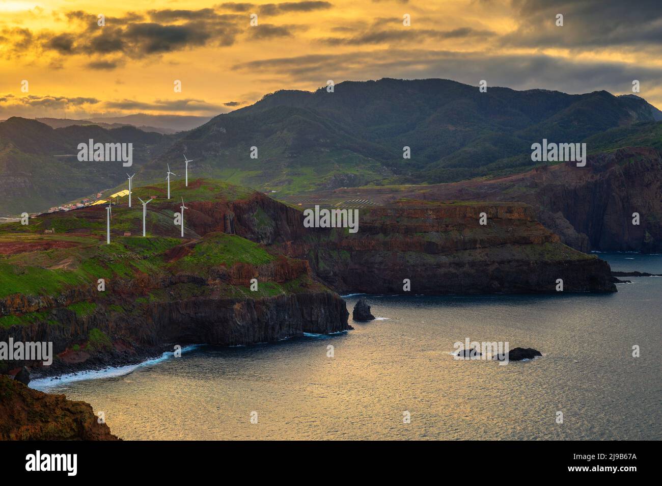 Sunset view of wind turbines for electricity production in Madeira ...