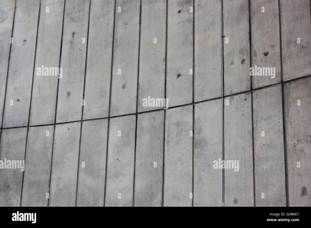 A minimalist view of a concrete panel floor with a radial pattern in ...