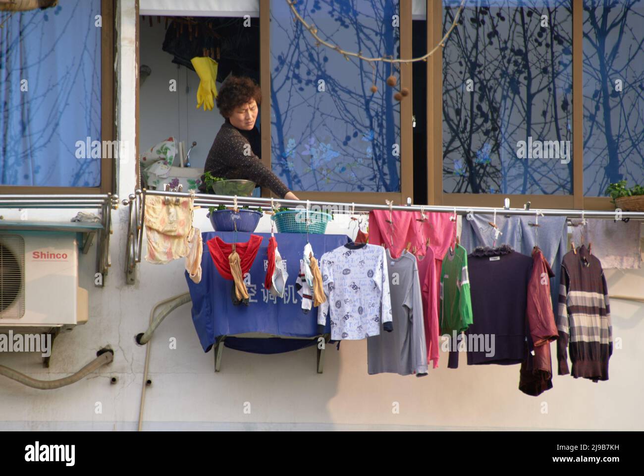 Woman hanging washing outside hi-res stock photography and images - Alamy