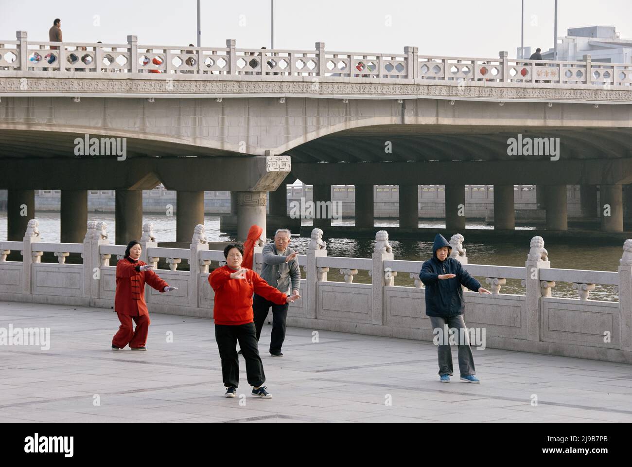Early morning Tai Chi lesson by the river, Suzhou, China Stock Photo ...