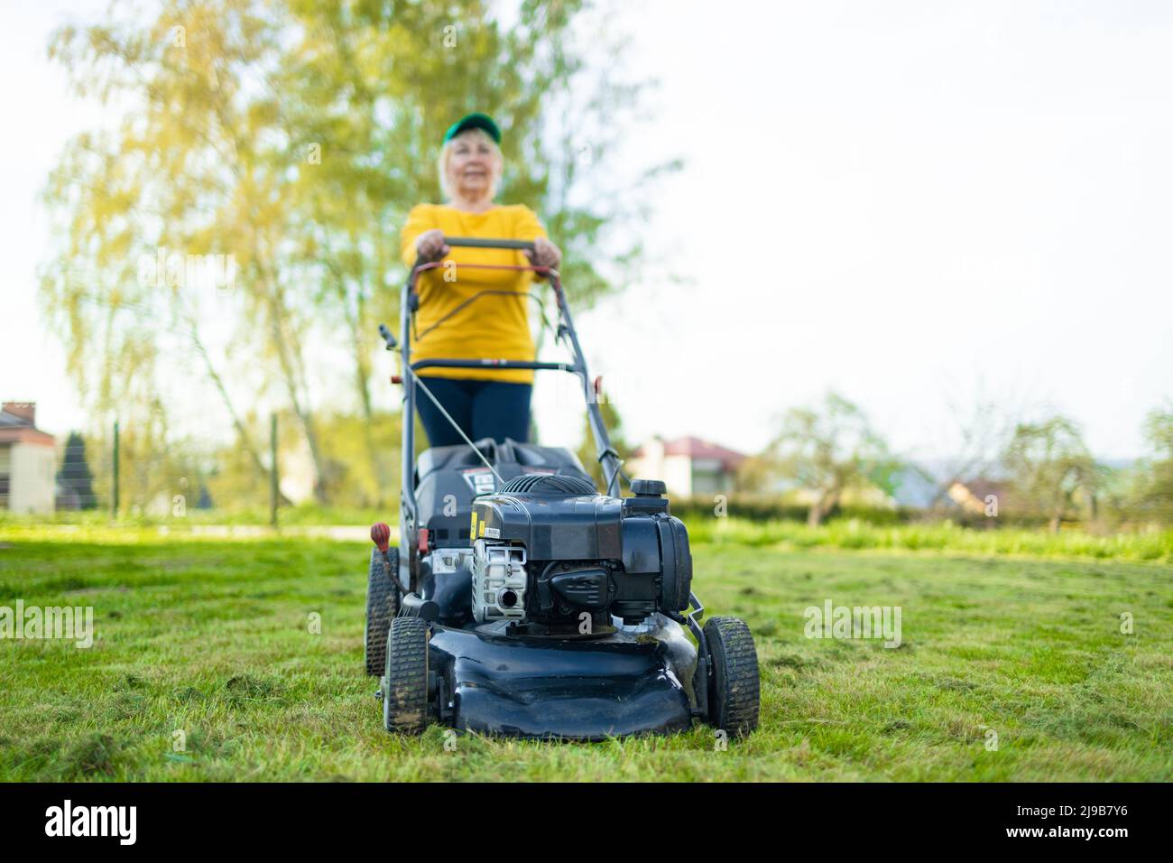 Woman lawn mover cutting hi-res stock photography and images - Alamy