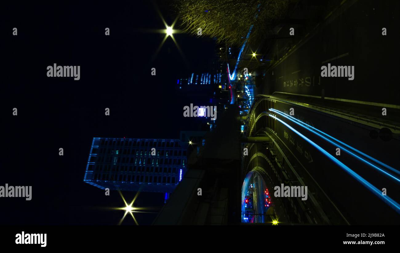 Night time lapse street at the business town in Akasaka Tokyo vertical ...