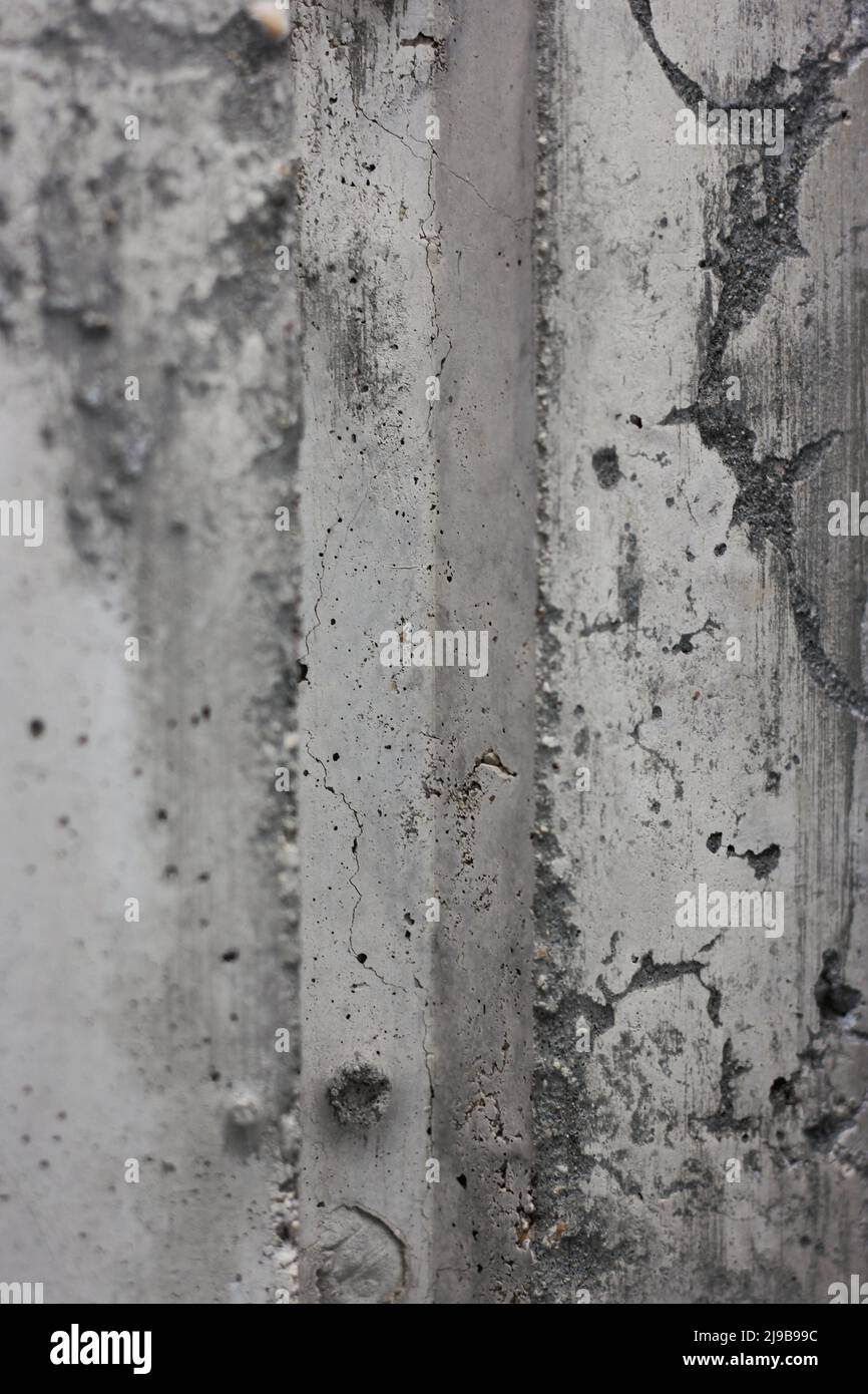 Closeup of a raw concrete wall as part of the structure of an abandoned ...
