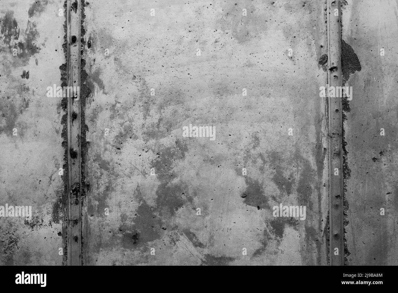 Closeup of a raw concrete wall as part of the structure of an abandoned ...