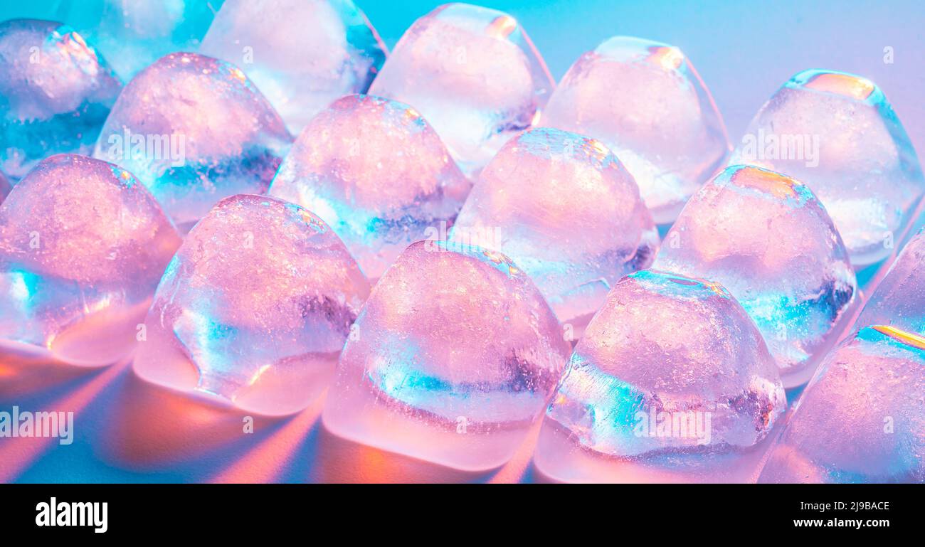 Ice for drinks in colored neon light Stock Photo - Alamy