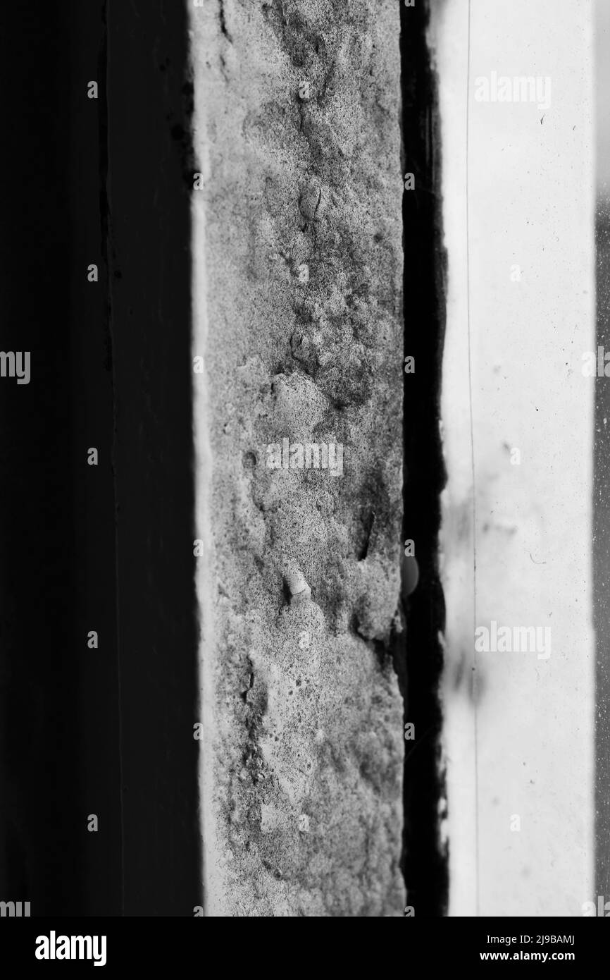 Closeup of a raw concrete wall as part of the structure of an abandoned ...