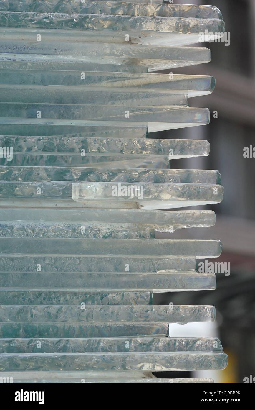 Layers of glass set upon one another as a stack of horizontal plates ...