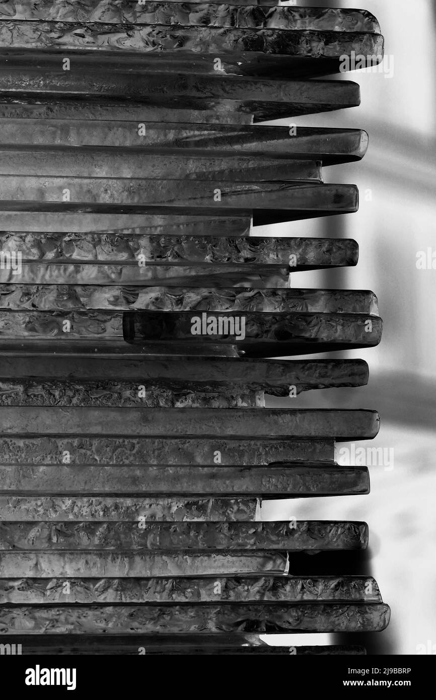 Layers of glass set upon one another as a stack of horizontal plates in ...