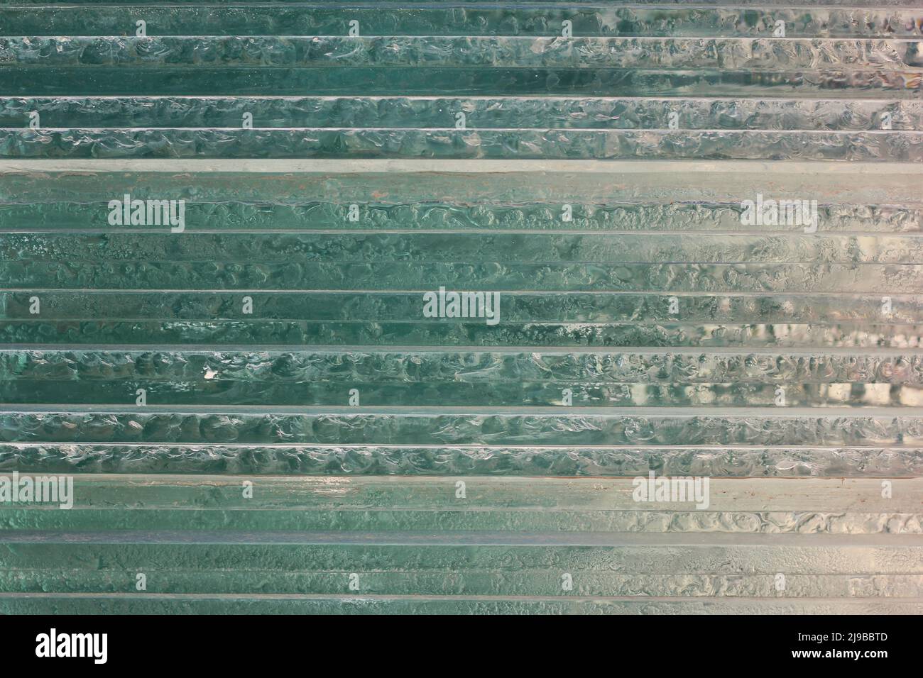 Layers of glass set upon one another as a stack of horizontal plates ...