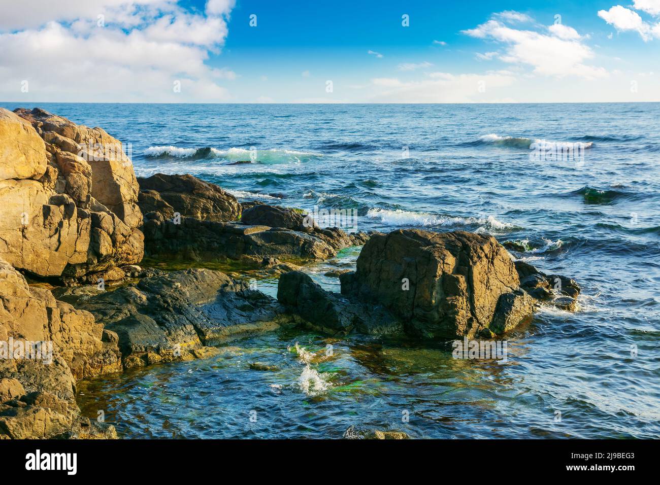 stones and rock at the sea. beautiful nature background with calm water ...