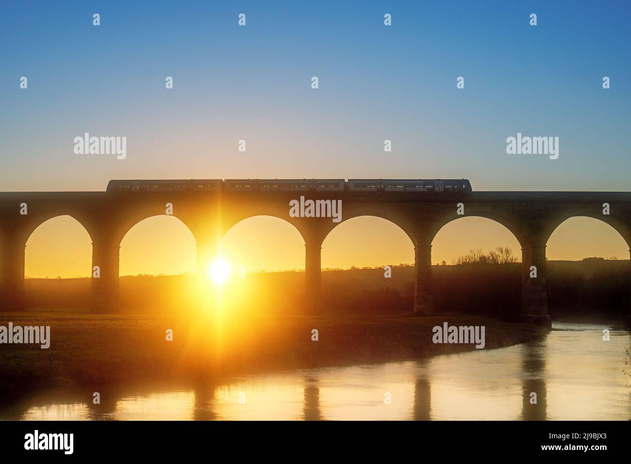 A Northern Rail train travelling over Arthington Viaduct railway bridge ...