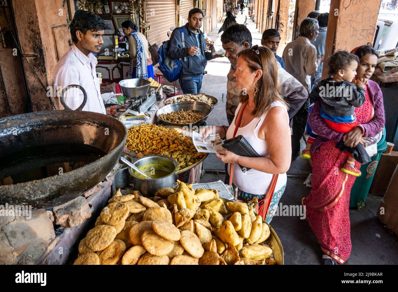 India woman buying food hi-res stock photography and images - Alamy