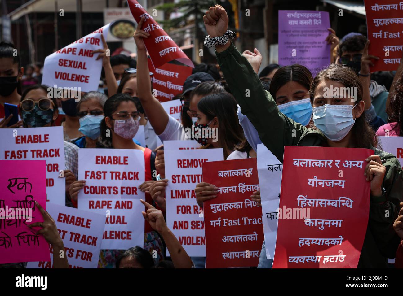 Youth from Civic Society display playcards and chants slogans during a ...