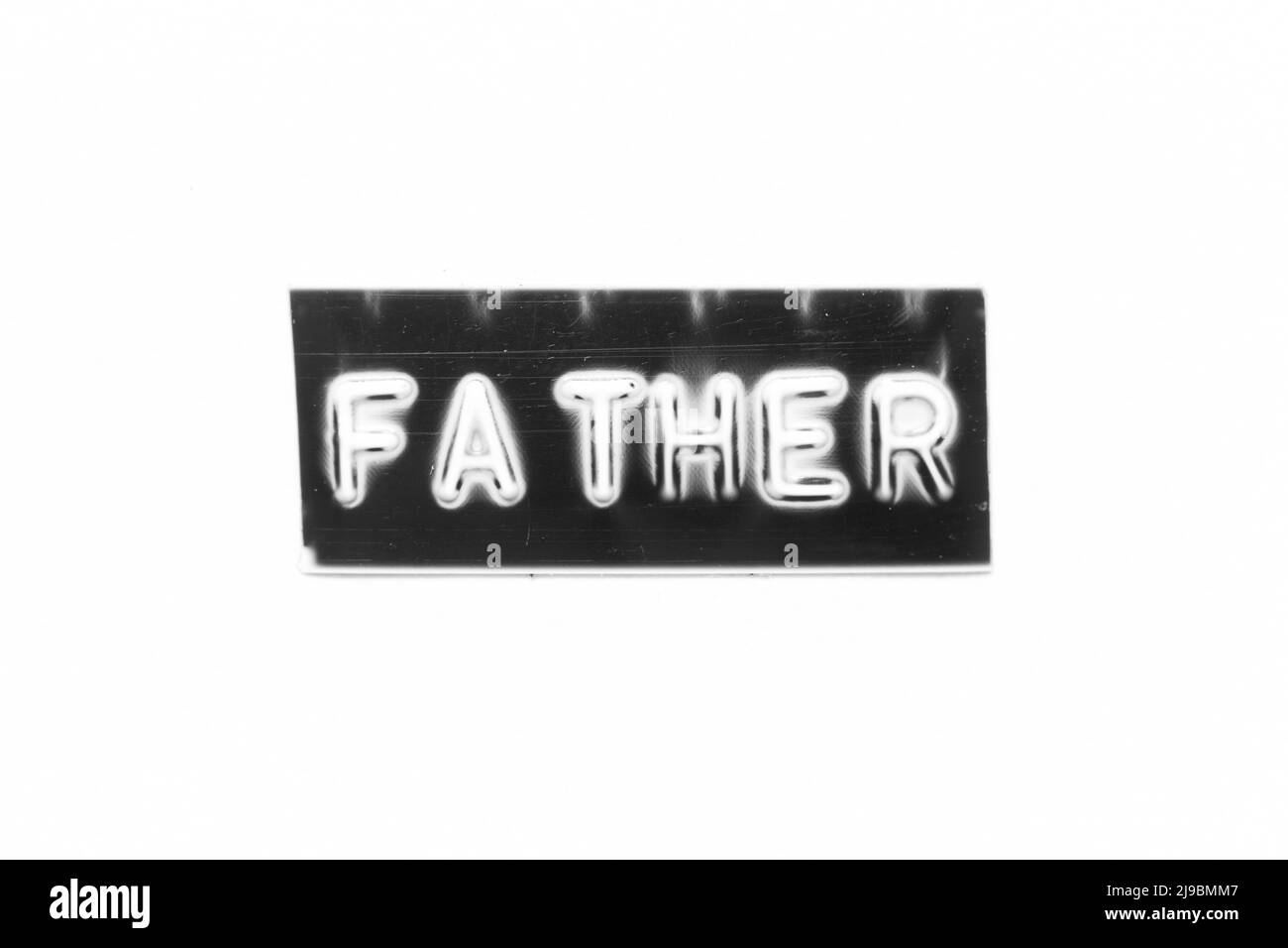 Black color banner that have embossed letter with word father on white ...