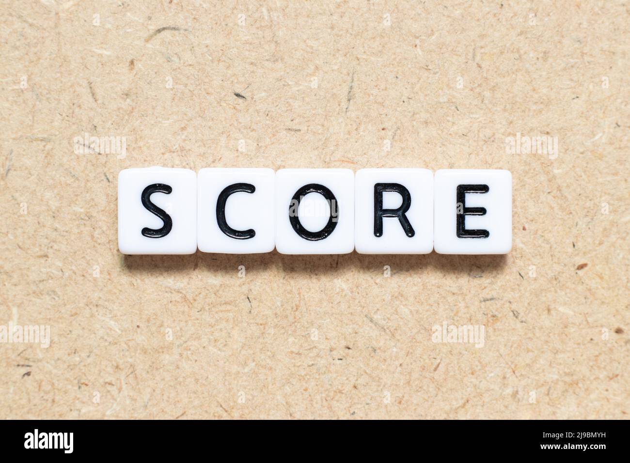 White tile alphabet letter with word score on wood background Stock ...