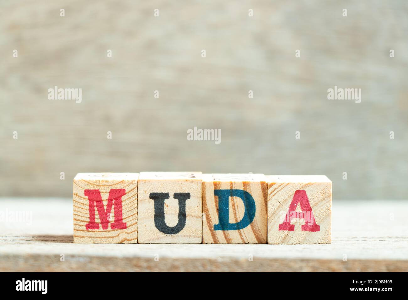 Alphabet letter block in word muda on wood background Stock Photo - Alamy