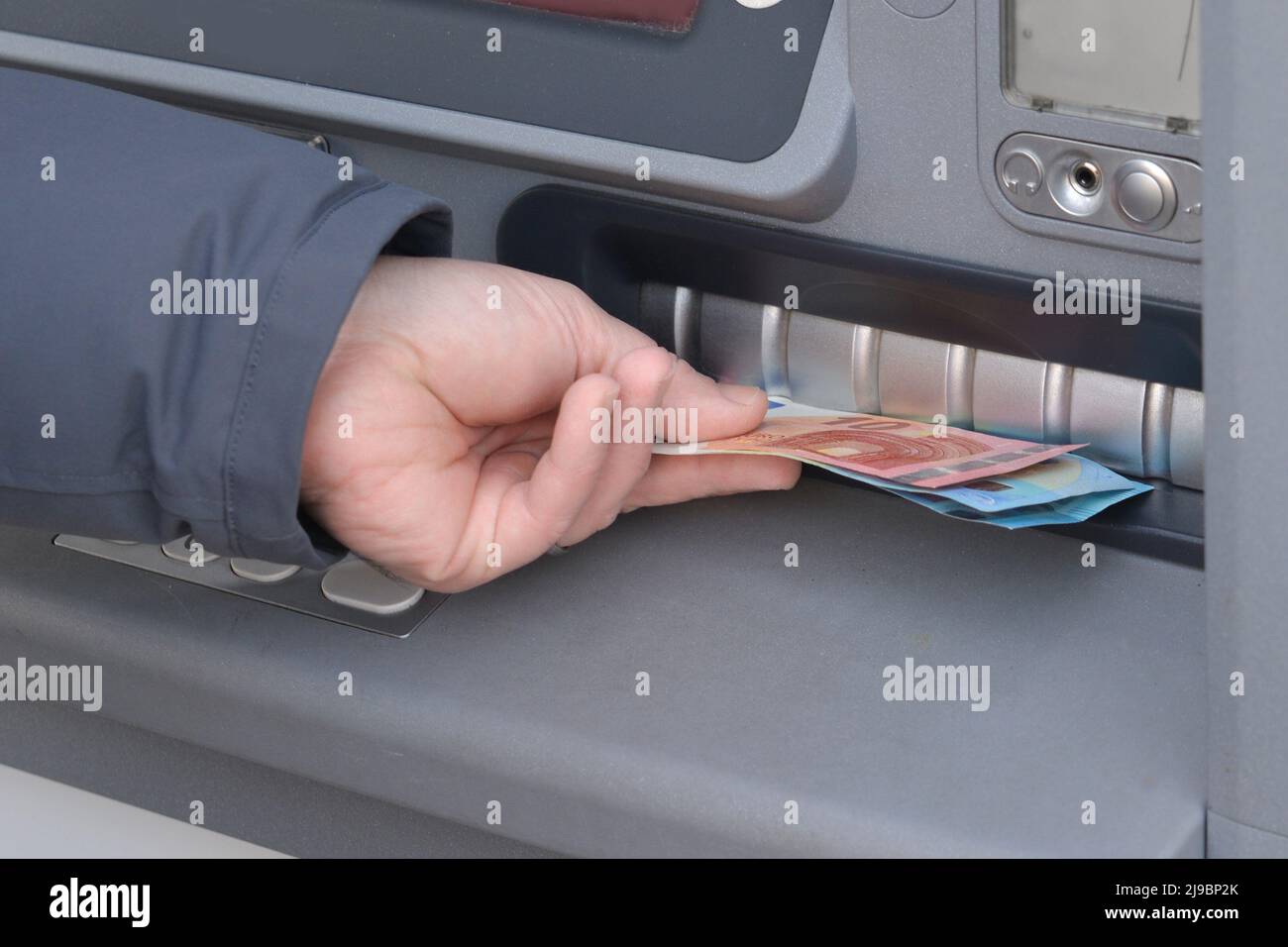 Man hand euro atm hi-res stock photography and images - Alamy