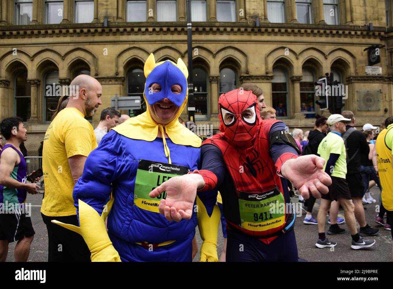 Manchester, UK, 22nd May, 2022. Runners wear a batman costume and a ...
