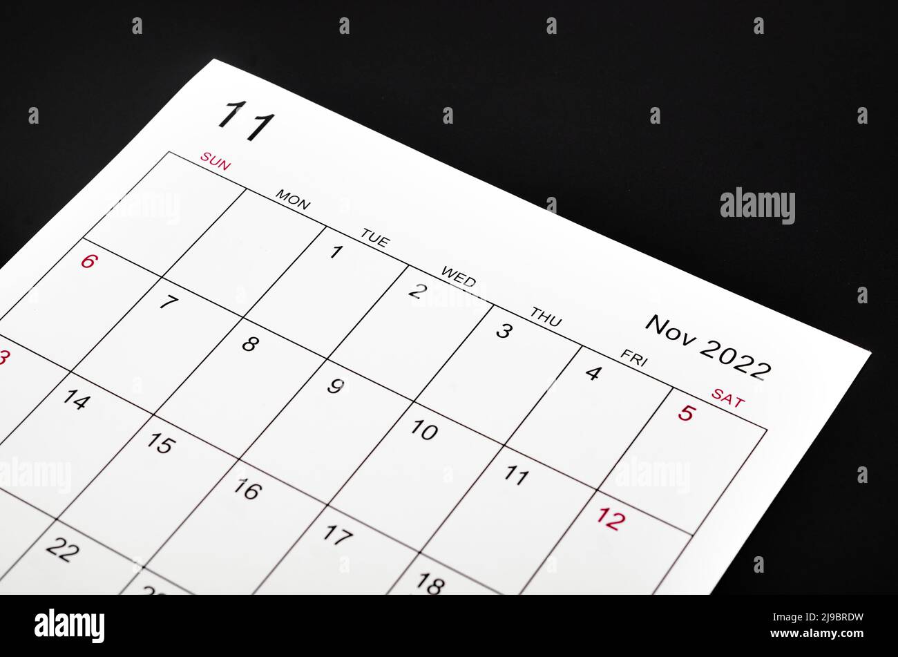 Close up November 2022 calendar sheet on black background Stock Photo ...