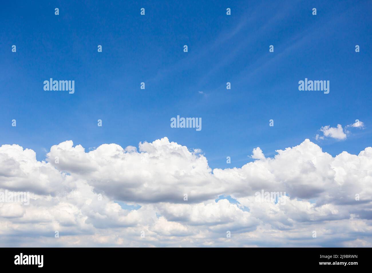 The Blue sky with scattered clouds Stock Photo - Alamy