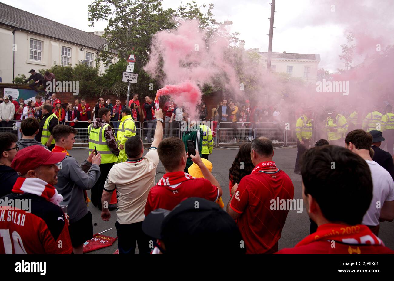 Liverpool fans light flares as they gather outside the ground prior to ...