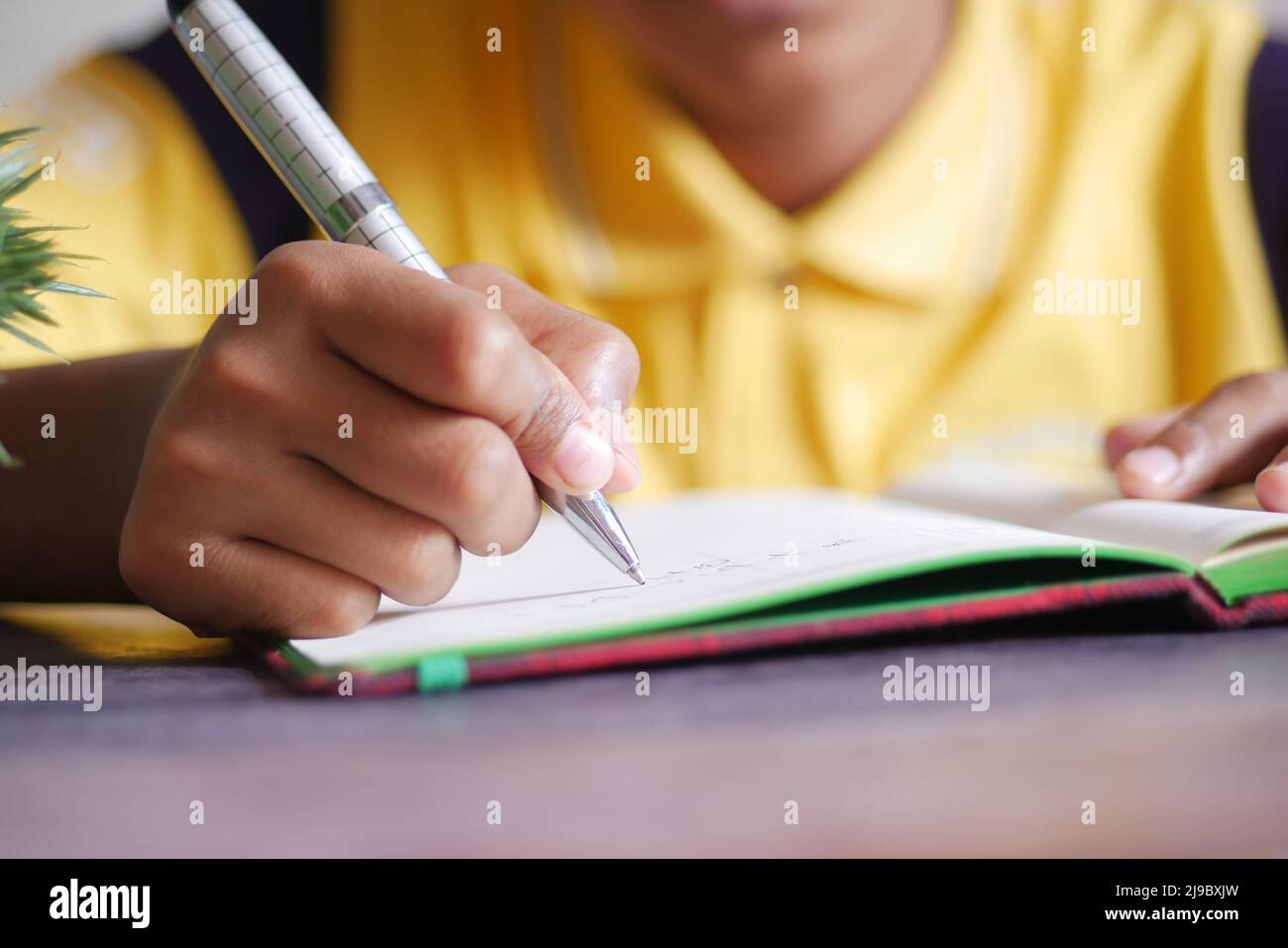 Child hand writing hi-res stock photography and images - Alamy