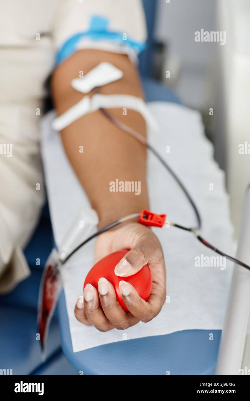 Close up of unrecognizable African American woman giving blood while ...
