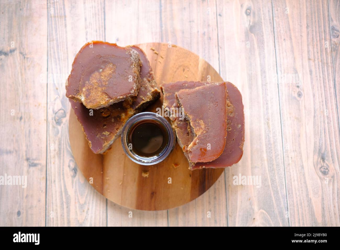 top view of stack of Jaggery traditional cane sugar cube on table Stock ...