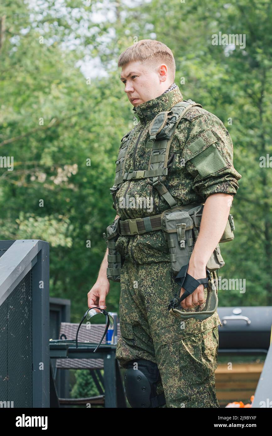 Military men with automatic weapons getting ready to play airsoft ...