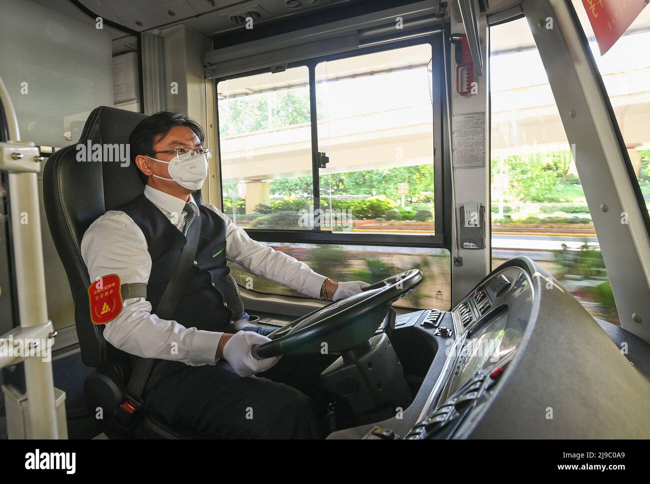 Shanghai, China. 22nd May, 2022. A driver drives a bus in Shanghai ...