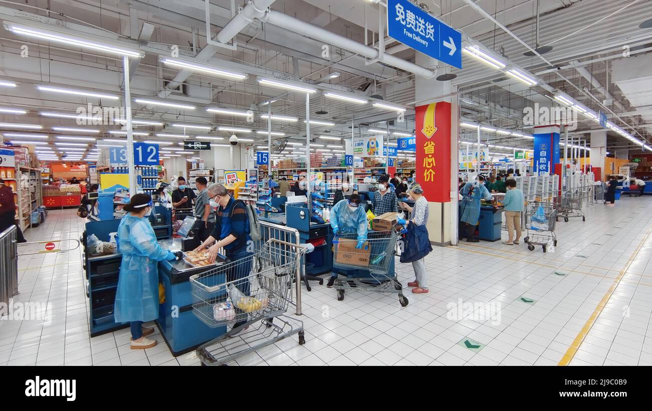 SHANGHAI, CHINA - MAY 21, 2022 - Citizens shop at a newly reopened Wal ...