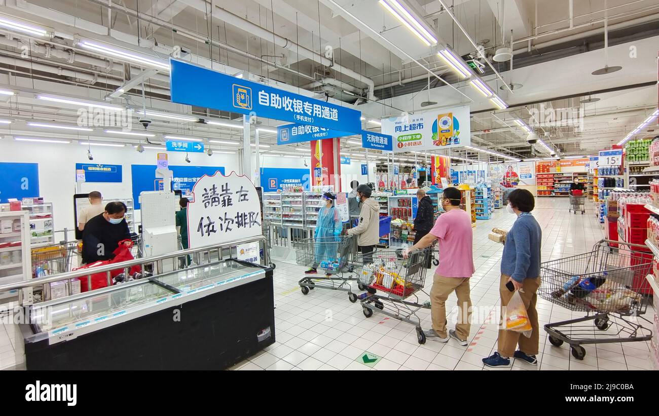 SHANGHAI, CHINA - MAY 21, 2022 - Citizens shop at a newly reopened Wal ...