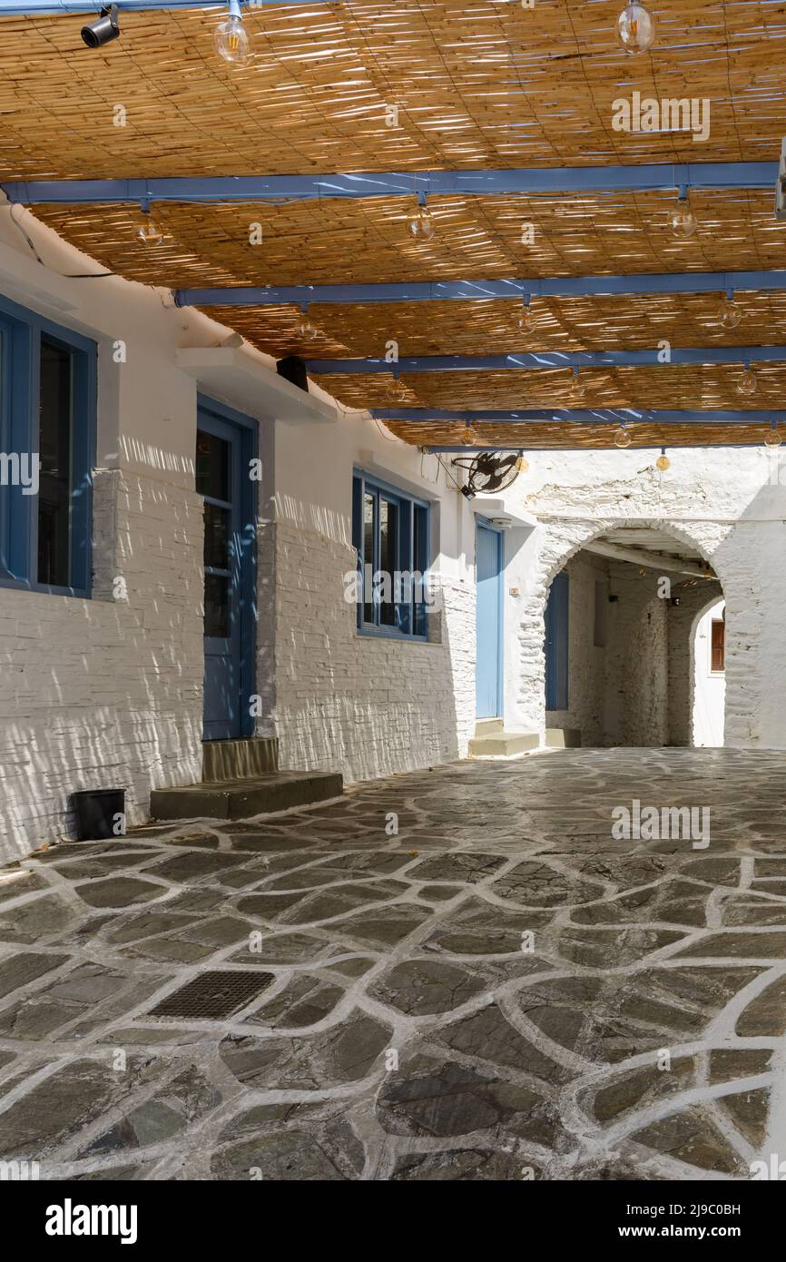 A street in the old town of Chora, the capital of Ios Island ...