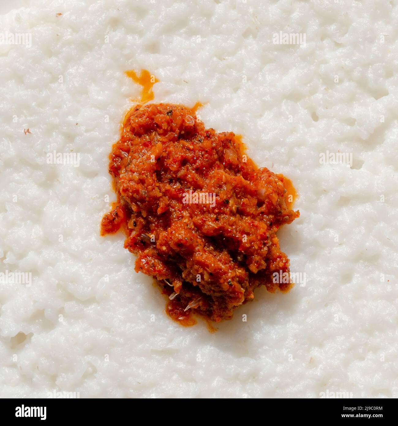 Spicy chili sambal on milk rice - Sri Lankan traditional food Stock ...