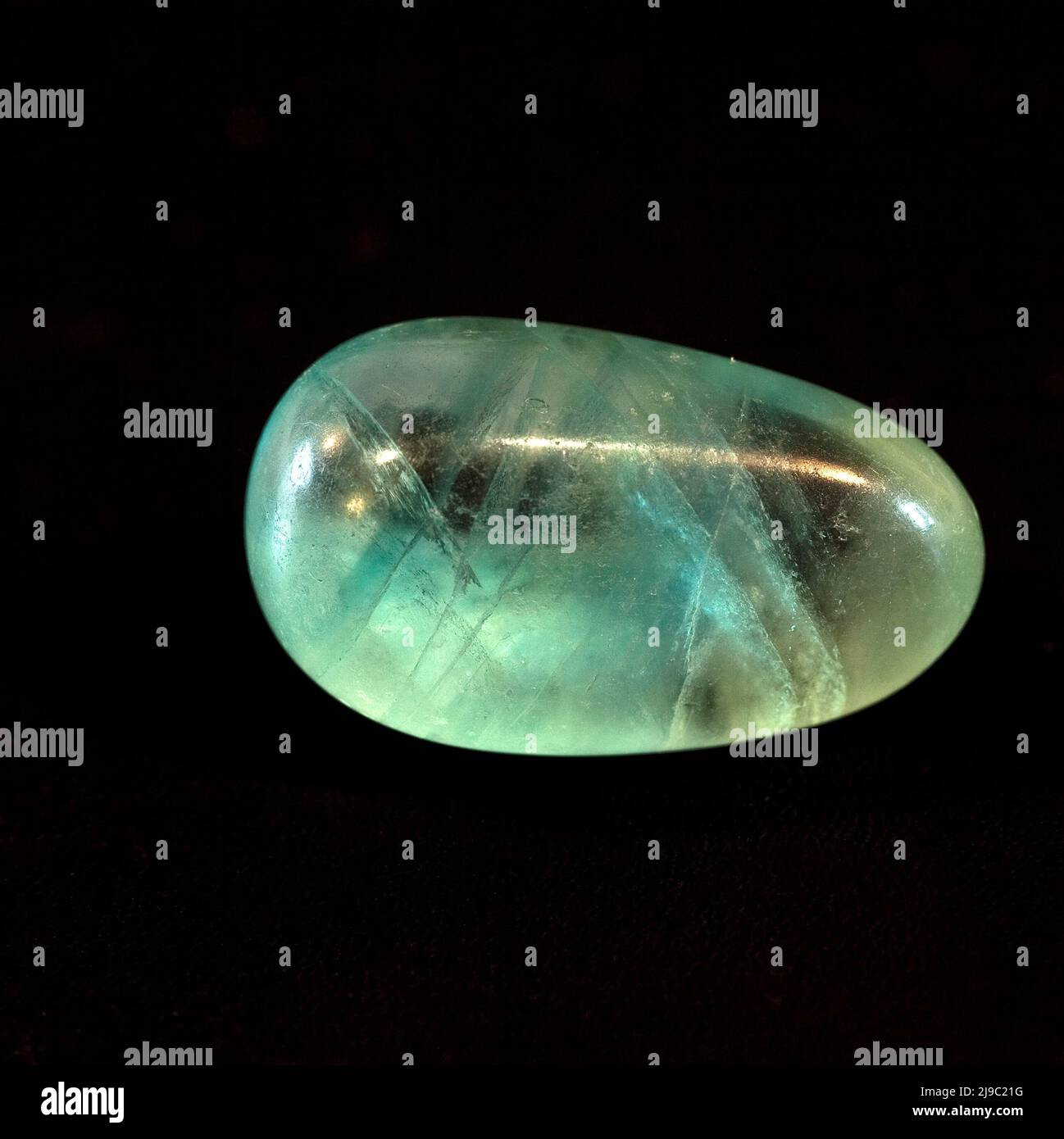 Macro close up colour photograph of a polished 'Blue Obsidian' a semi ...