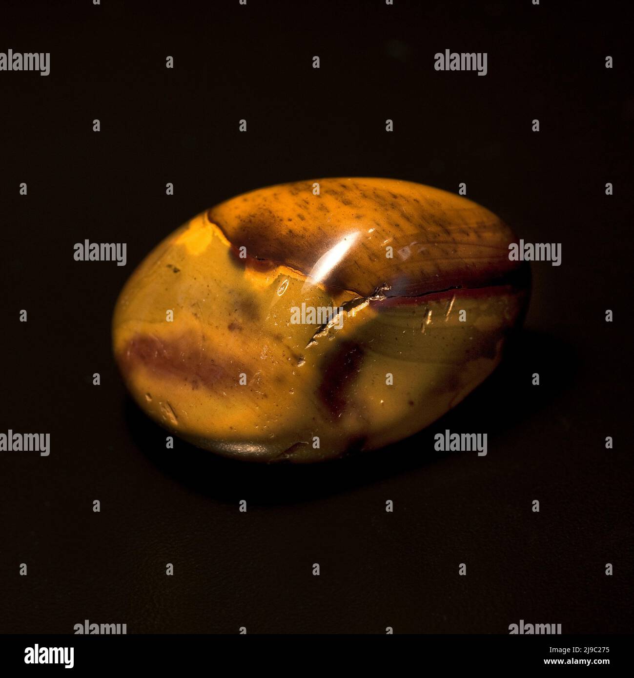 Macro close up colour photograph of a polished 'Mookaite' a semi ...